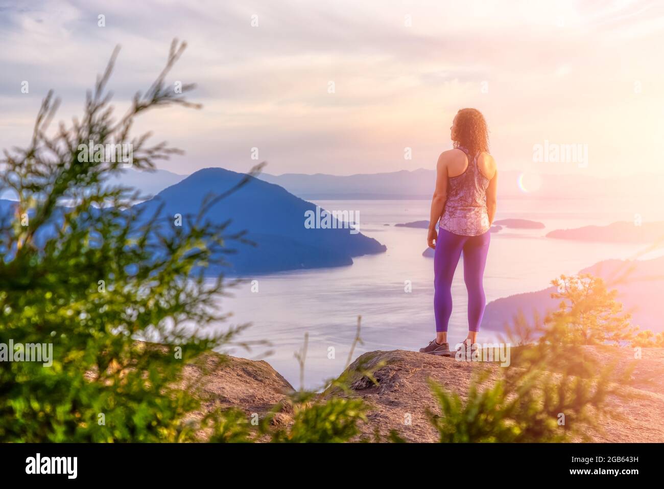 Adventurous Woman Hiking on top of Mountain Landscape Stock Photo - Alamy