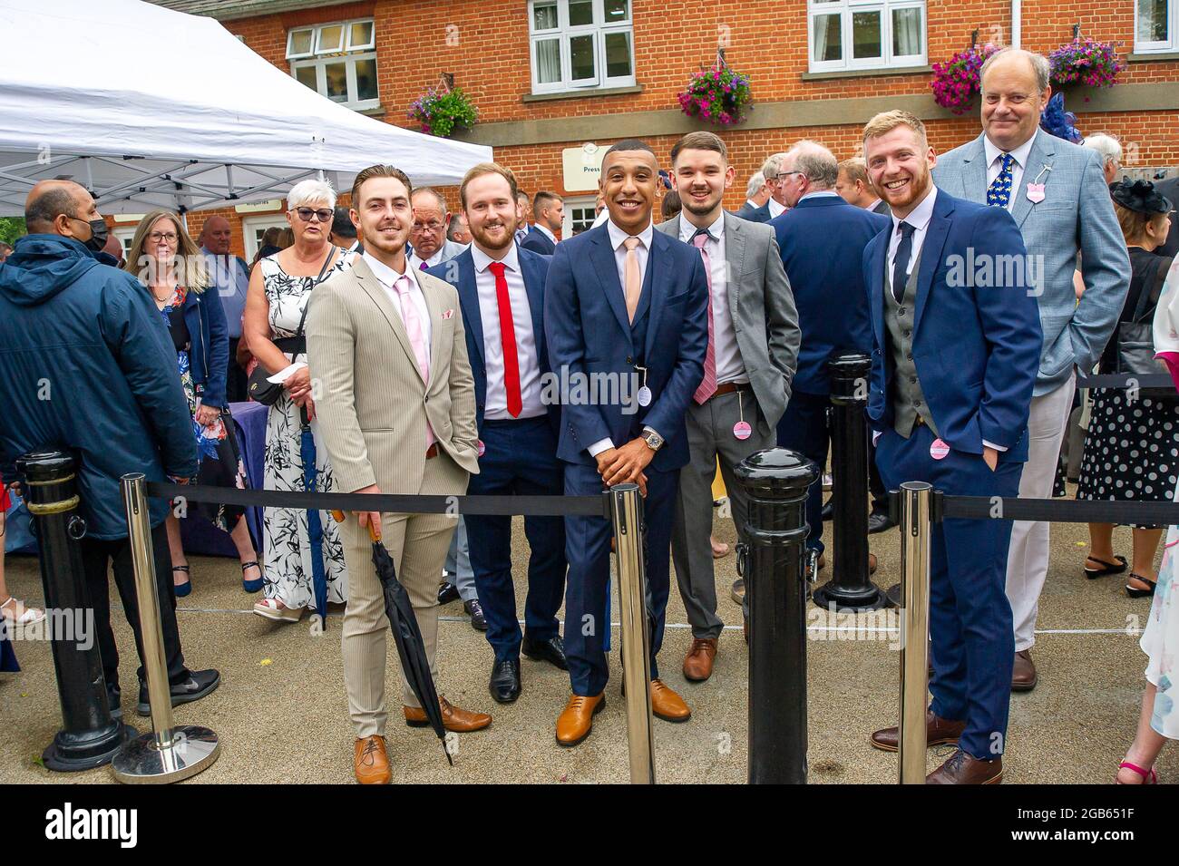 24th July, 2021. Racegoers queue for racing outside Ascot Racecourse ...