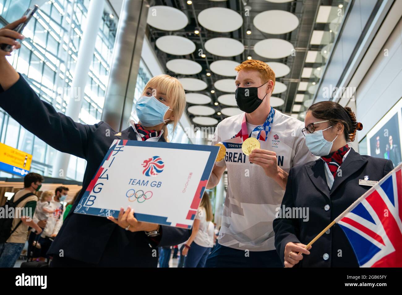 British swimmer Tom Dean arrives back at London Heathrow Airport from ...