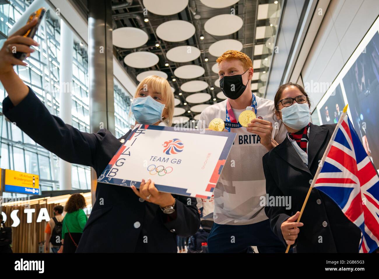 British swimmer Tom Dean arrives back at London Heathrow Airport from ...