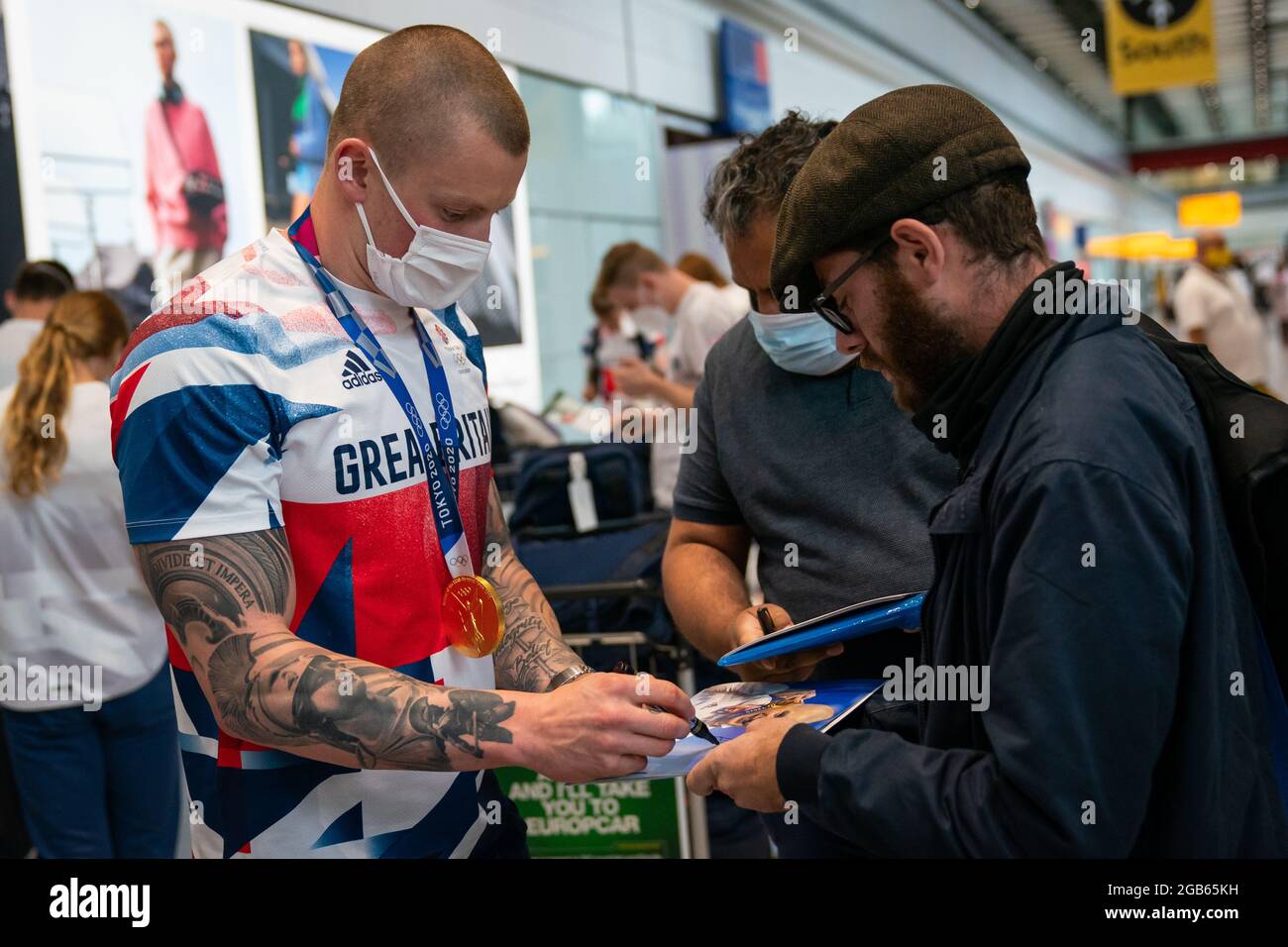 British swimmer Adam Peaty arrives back at London Heathrow Airport from ...