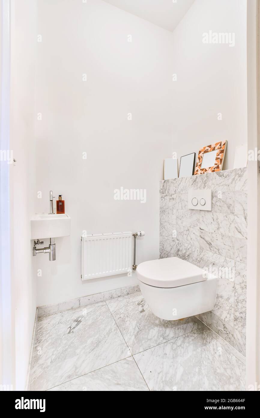 Interior of small clean washroom in miniature style Stock Photo - Alamy