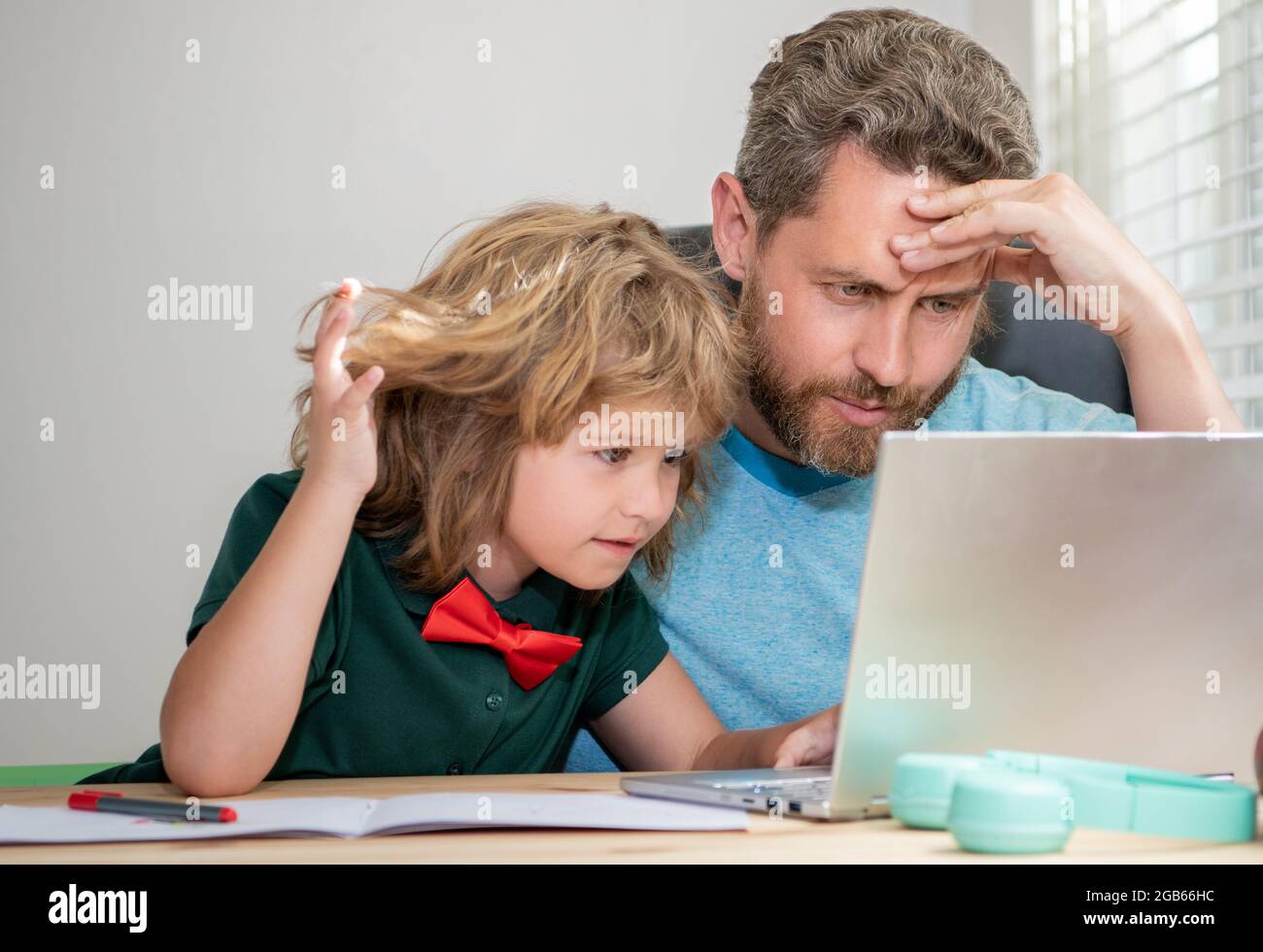 family and parenthood blog. boy do homework with private teacher. webinar video lesson Stock ...