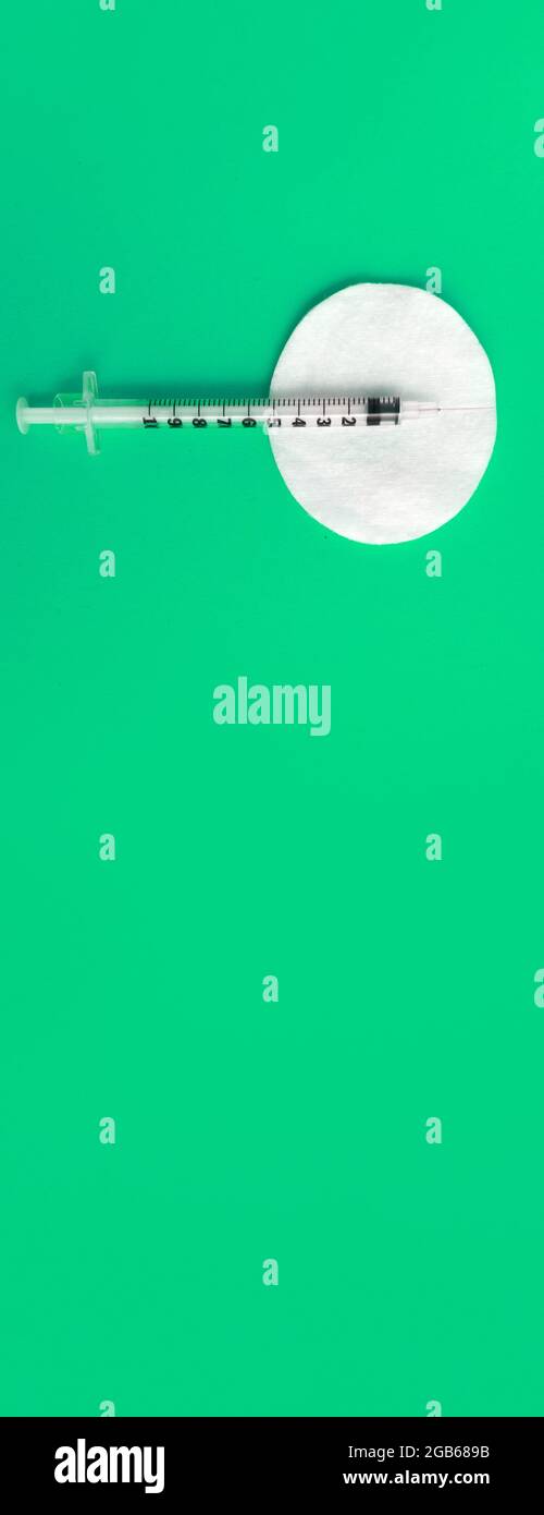 medical syringes on green panorama background Stock Photo - Alamy