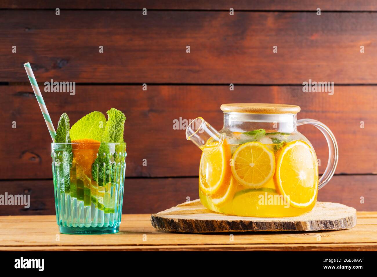 Lime mint iced tea in a transparent teapot. Lemonade drink of water ...