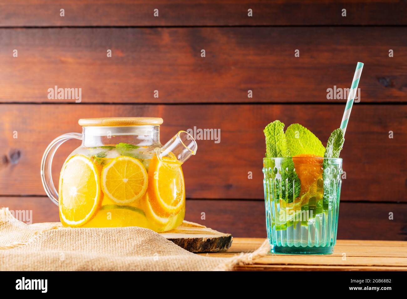 Lime mint iced tea in a transparent teapot. Lemonade drink of water ...