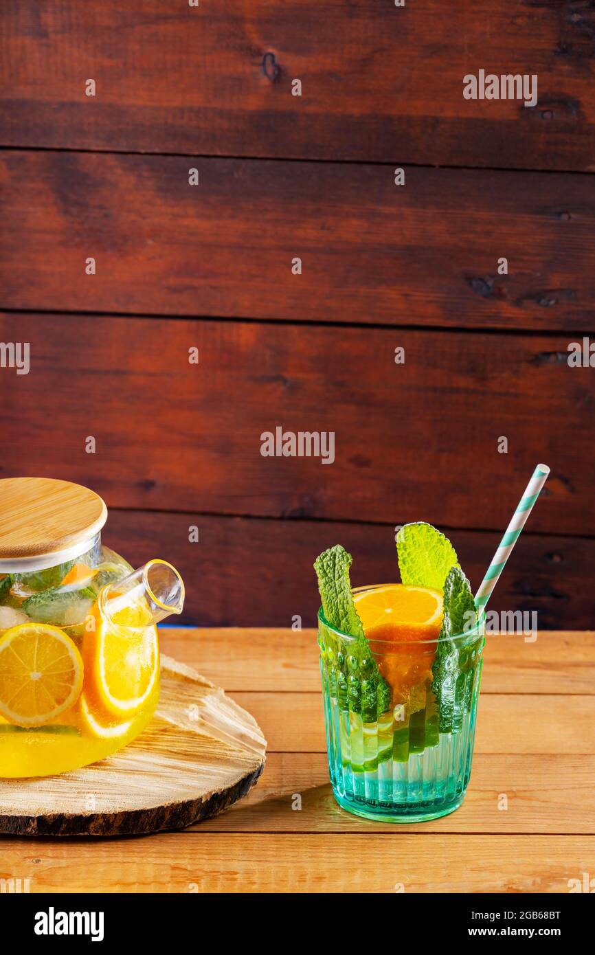 Lime mint iced tea in a transparent teapot. Lemonade drink of water ...