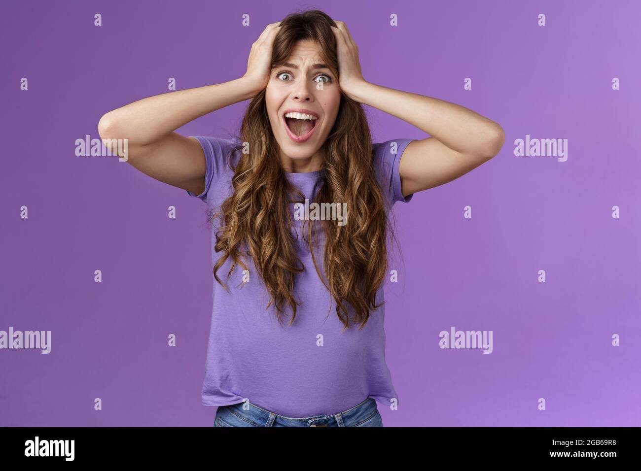 Shocked upset disappointed curly girl shouting sorrow face troublesome ...
