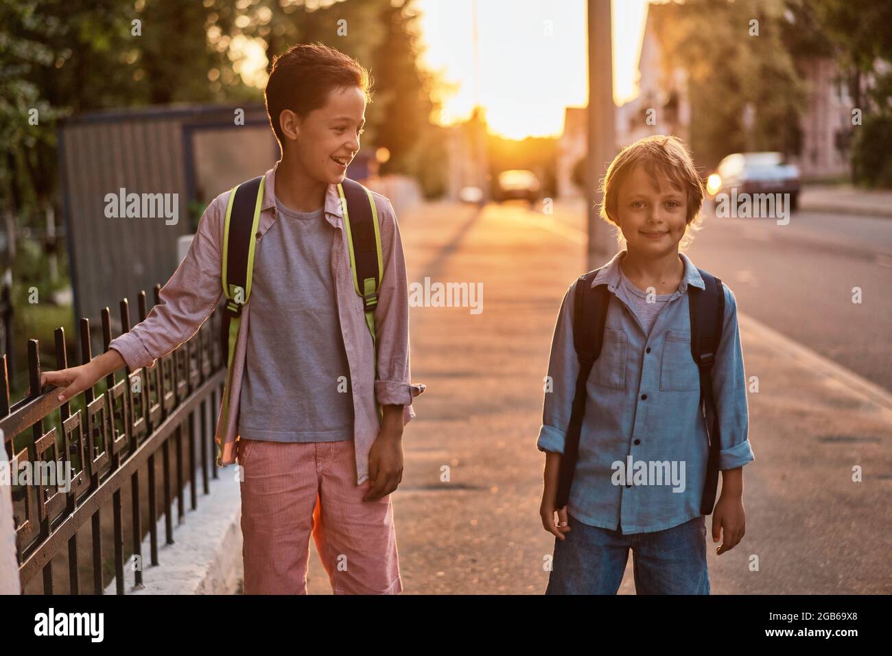 School boys running to school. School boys having fun after school ...