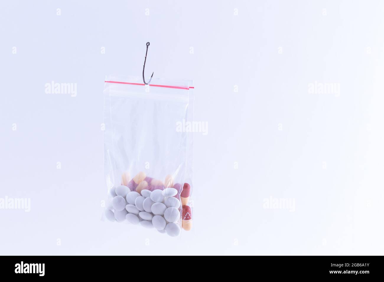 Pills on hook hi-res stock photography and images - Alamy