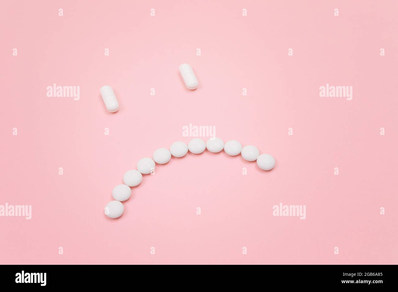 Pharma Harm. Sad Smiley Face Made from White Pills, Lying on Pink ...