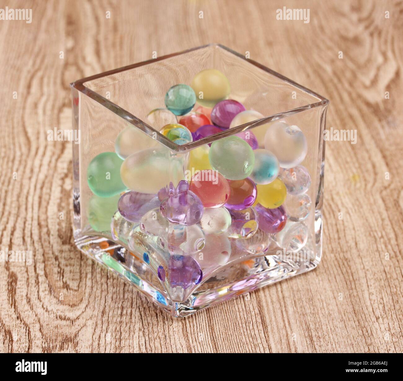 Color hydrogel in vase on wooden background Stock Photo - Alamy