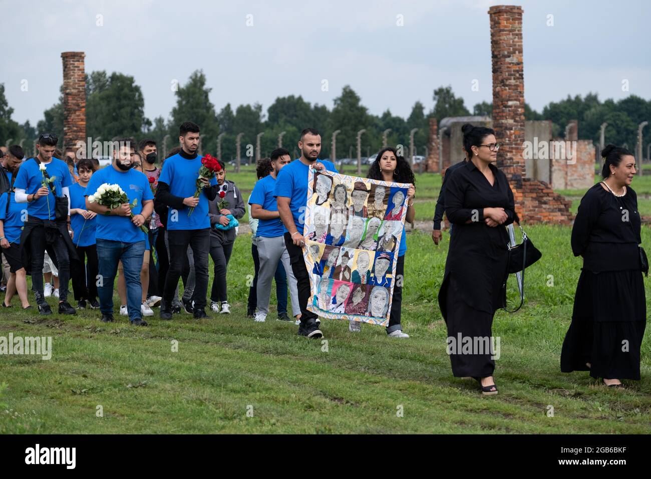 Brzezinka, Poland. 02nd Aug, 2021. A group of Gypsies holding a poster ...
