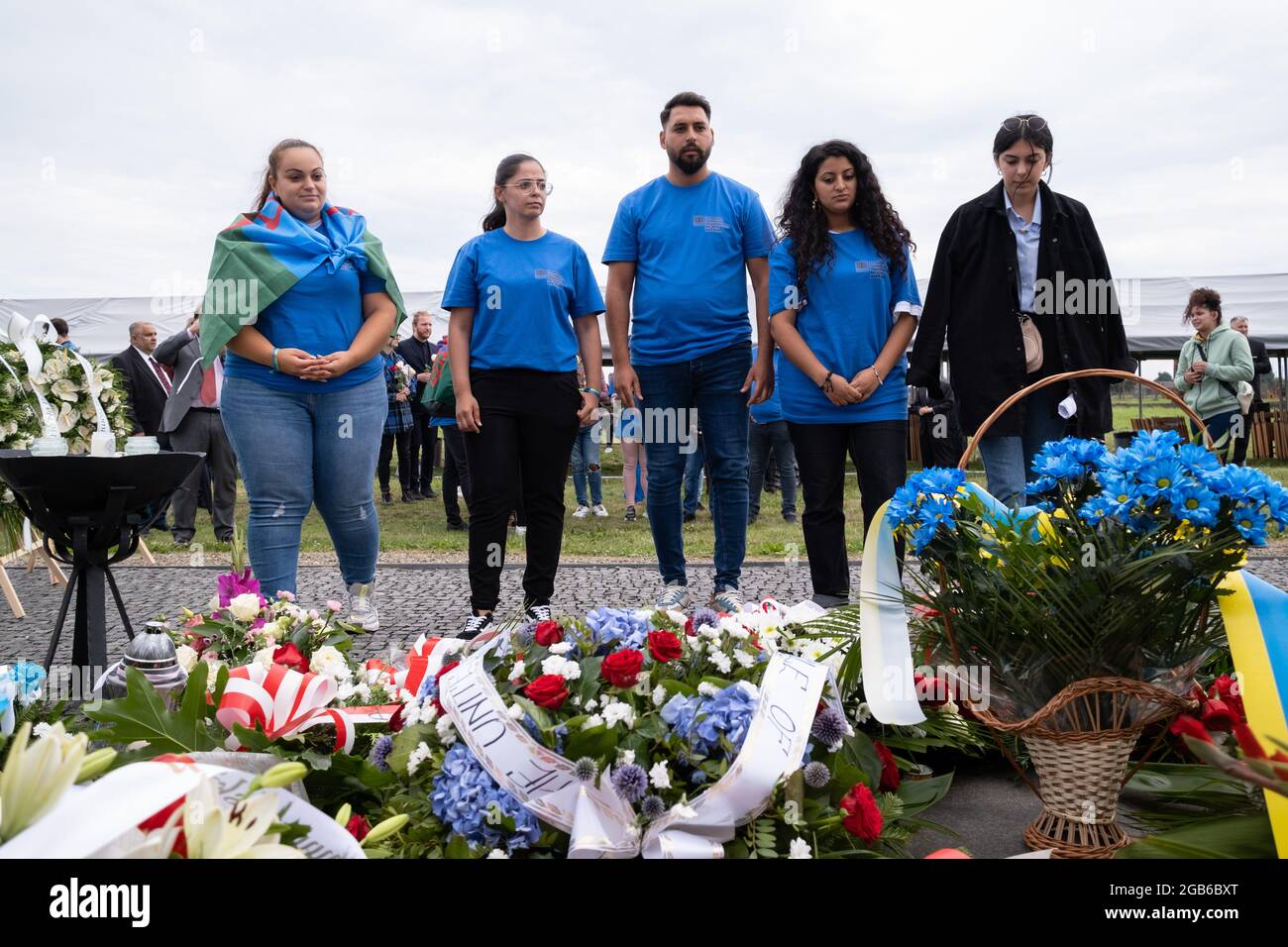 Brzezinka, Poland. 02nd Aug, 2021. A group of Gypsies stand in front of ...