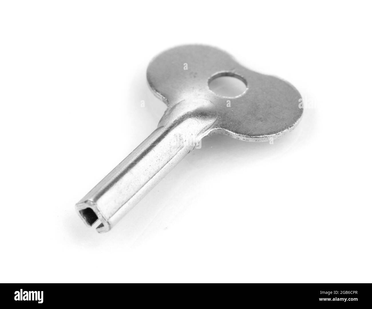 Winding key isolated on white Stock Photo - Alamy