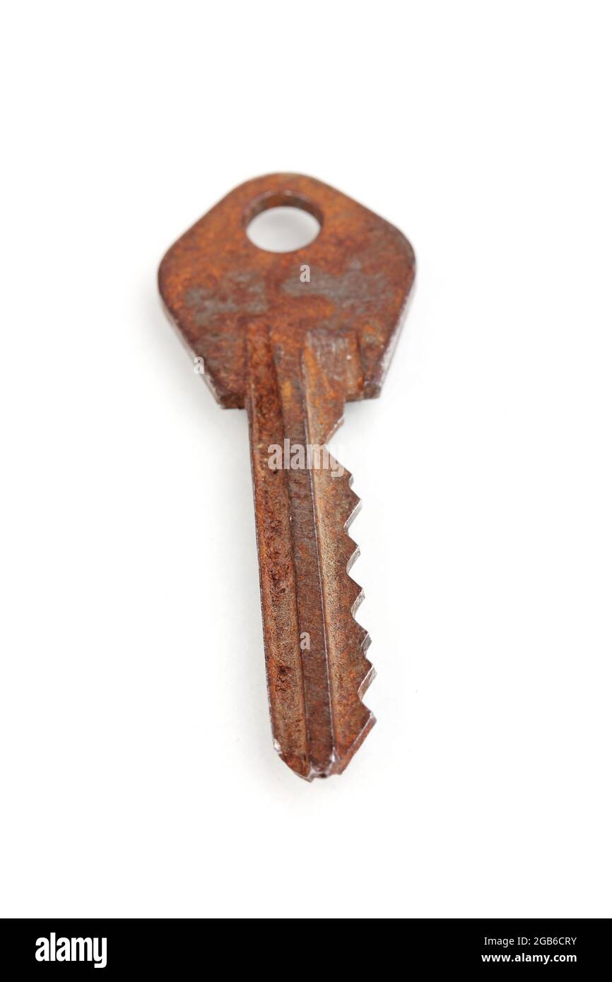 Metal key isolated on white Stock Photo - Alamy