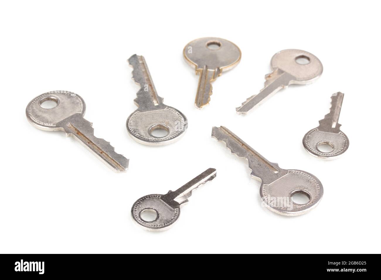 Many metal keys isolated on white Stock Photo - Alamy