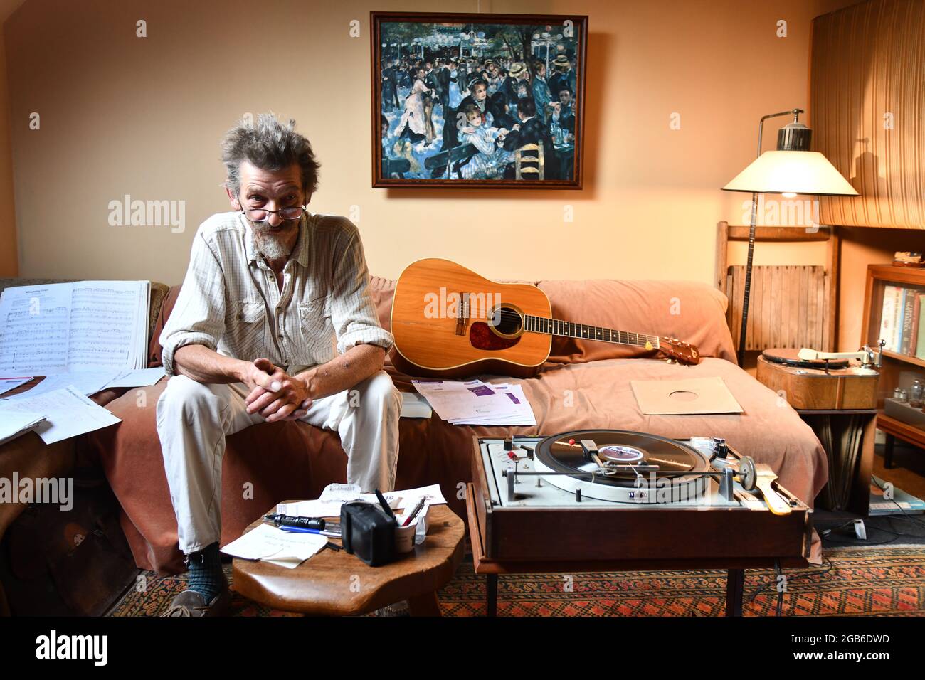 Man playing vinyl records on old record turntable in a classical retro ...