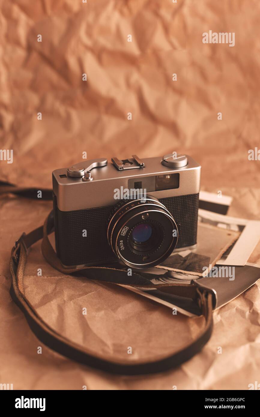Vintage film camera on crumpled paper background. FED Mikron-2 ...