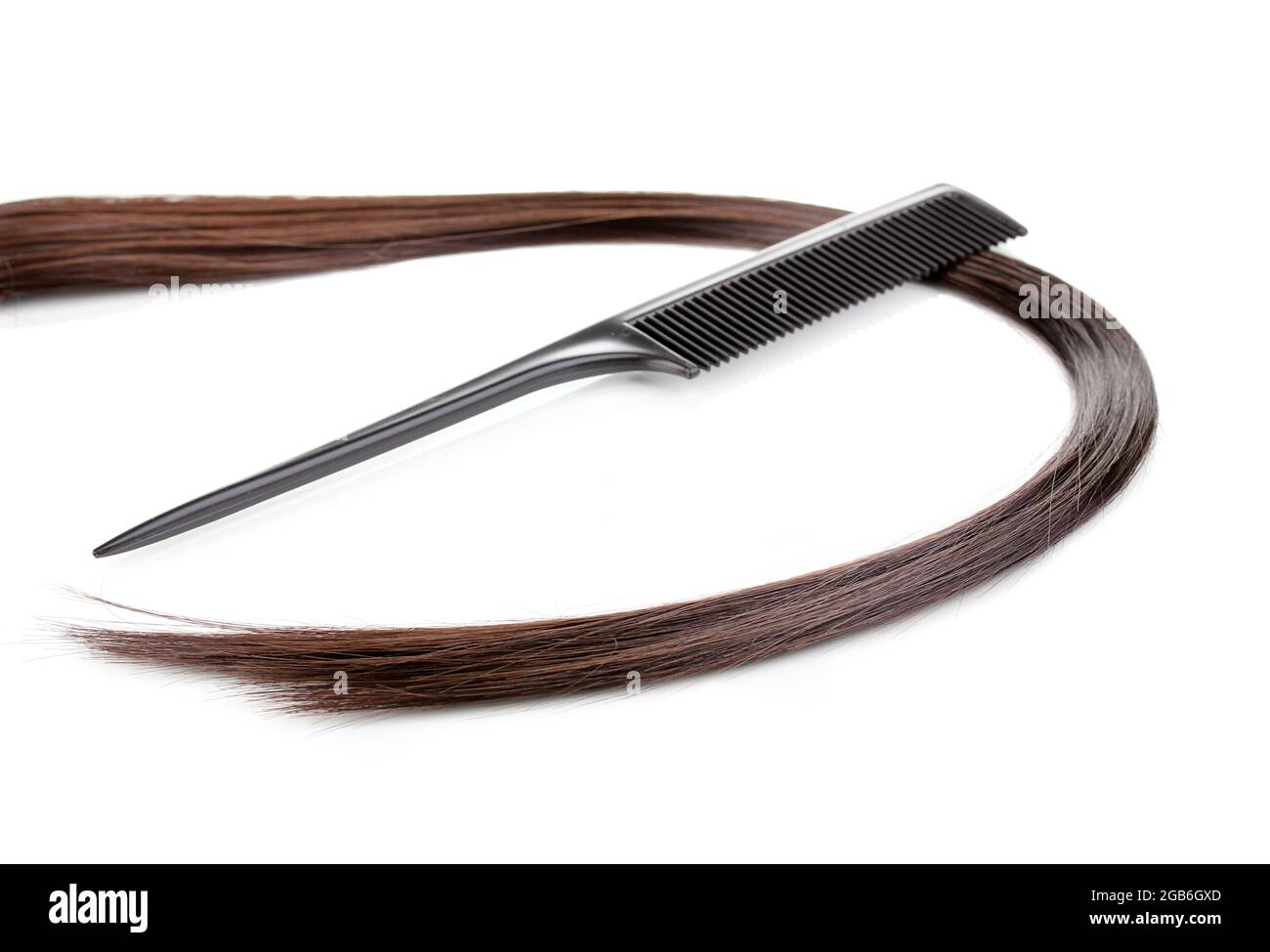 Shiny brown hair and comb isolated on white Stock Photo - Alamy