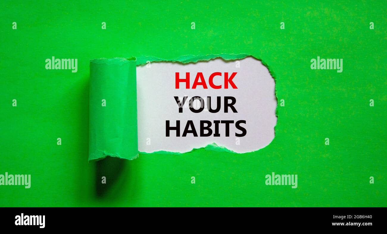 Hack your habits symbol. Words 'Hack your habits' appearing behind torn ...