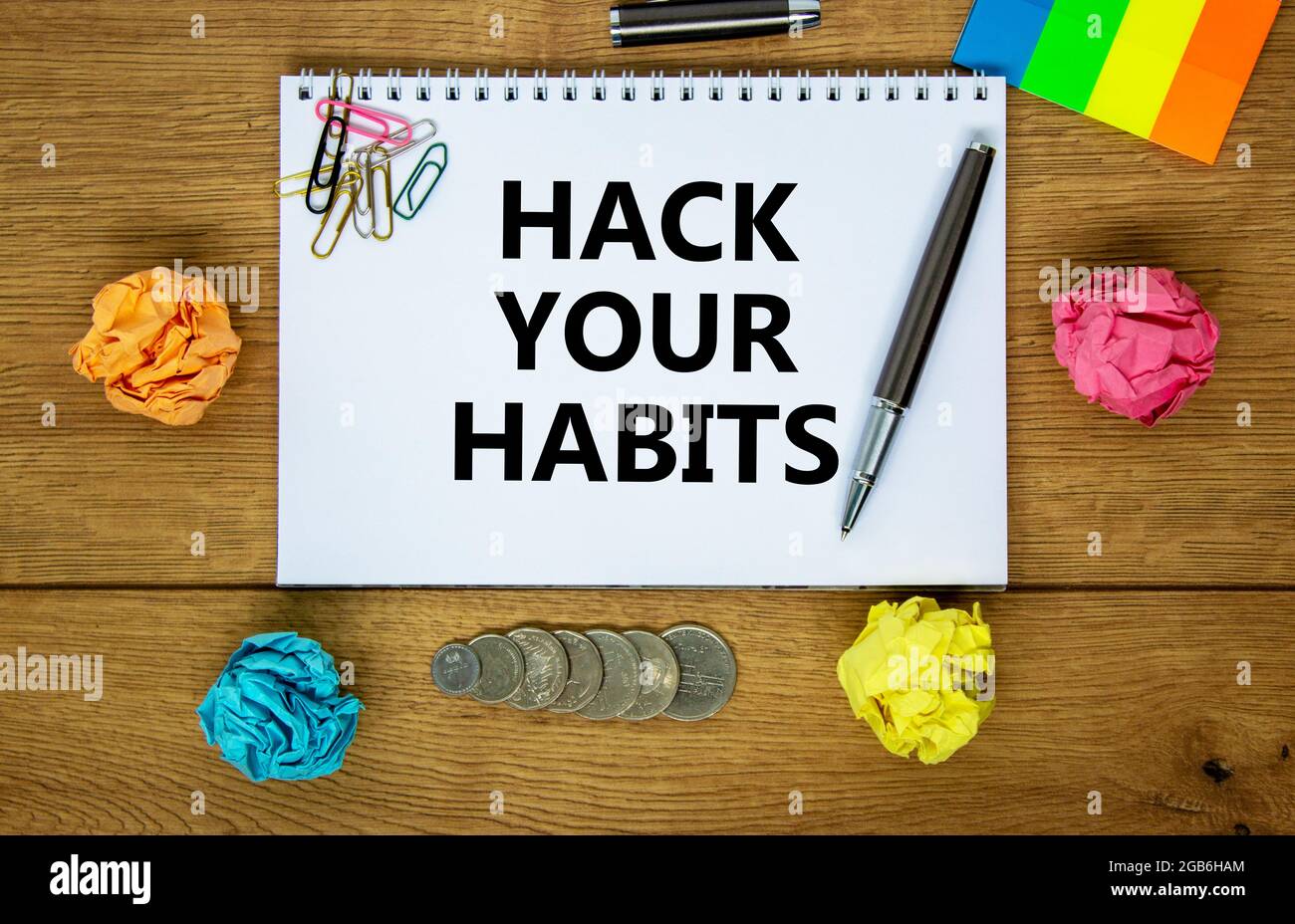 Hack your habits symbol. Words 'Hack your habits' on white note. Wooden ...