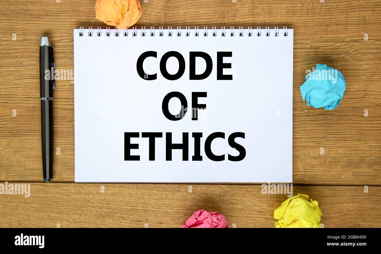 Code of ethics symbol. Words 'Code of ethics' on beautiful wooden table ...