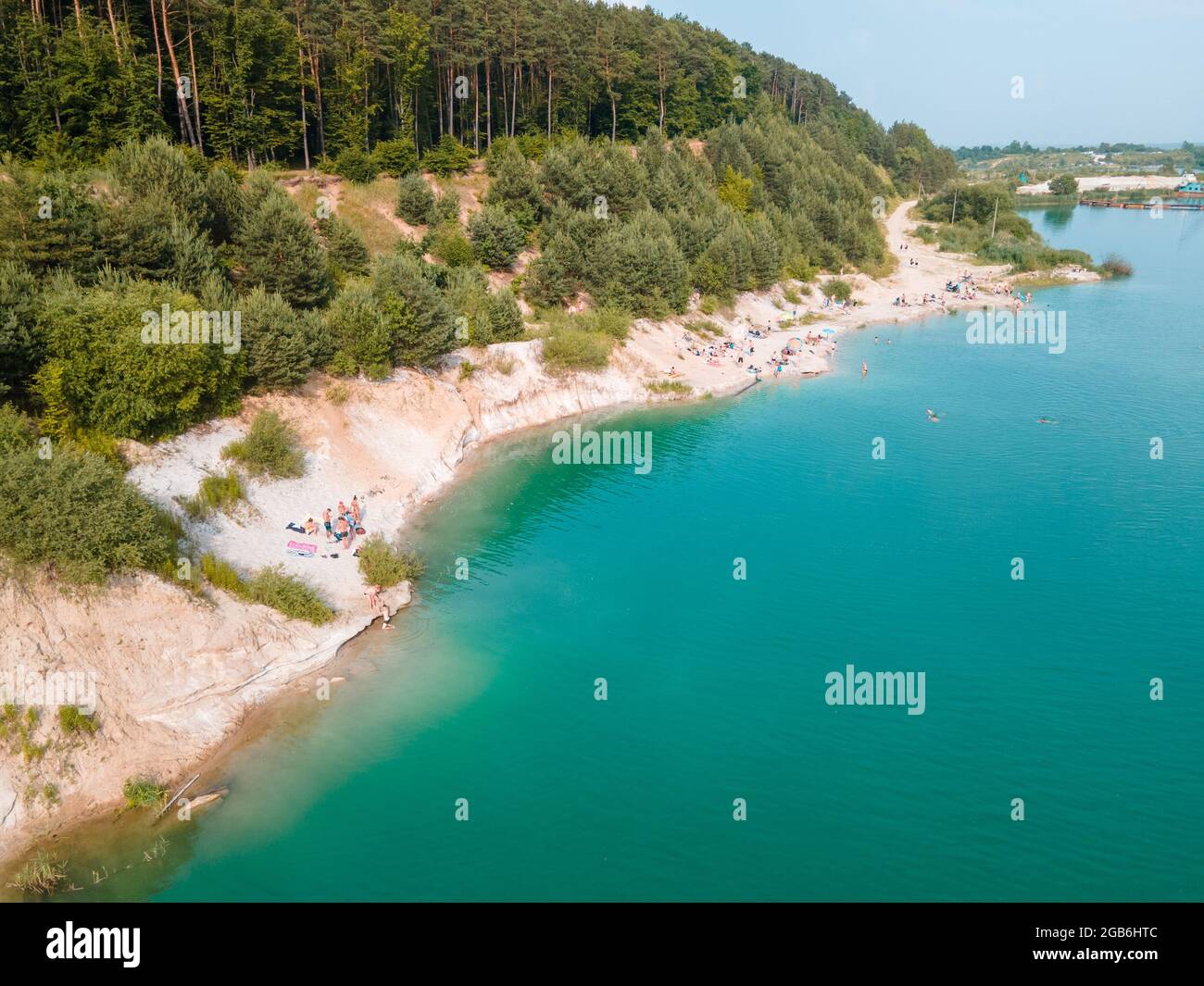 aerial view of people swimming in blue azure water sunbathing resting ...