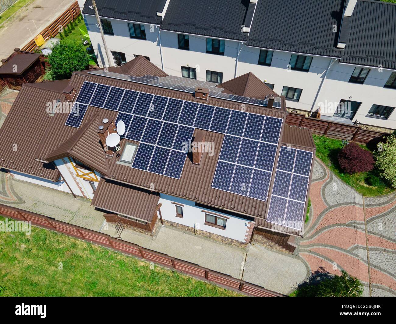 aerial view of house building with solar sun panels clean energy ...