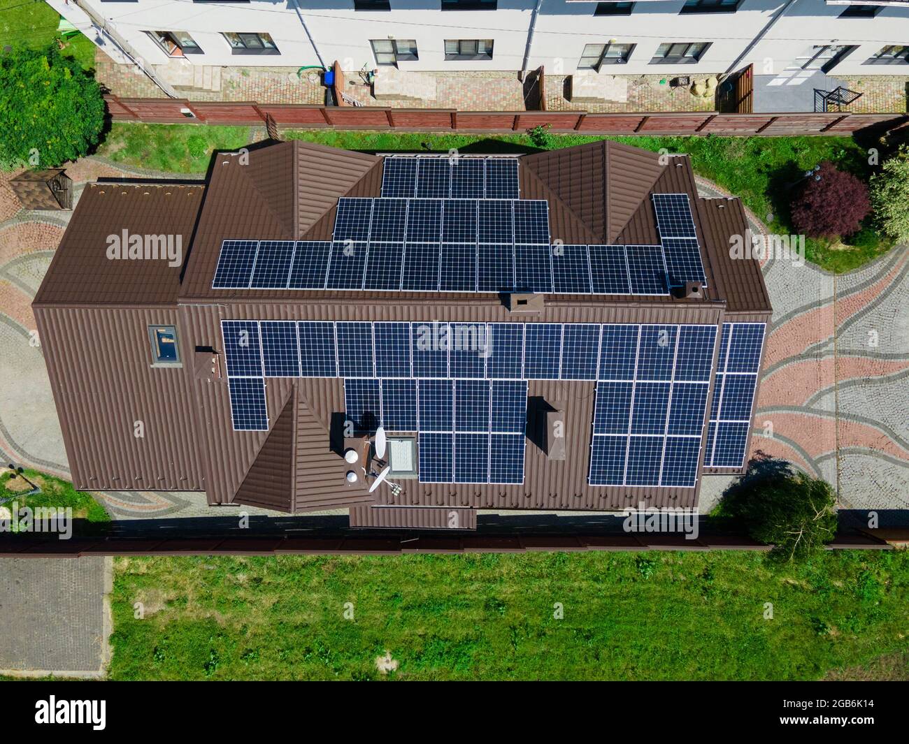 aerial view of house building with solar sun panels clean energy ...
