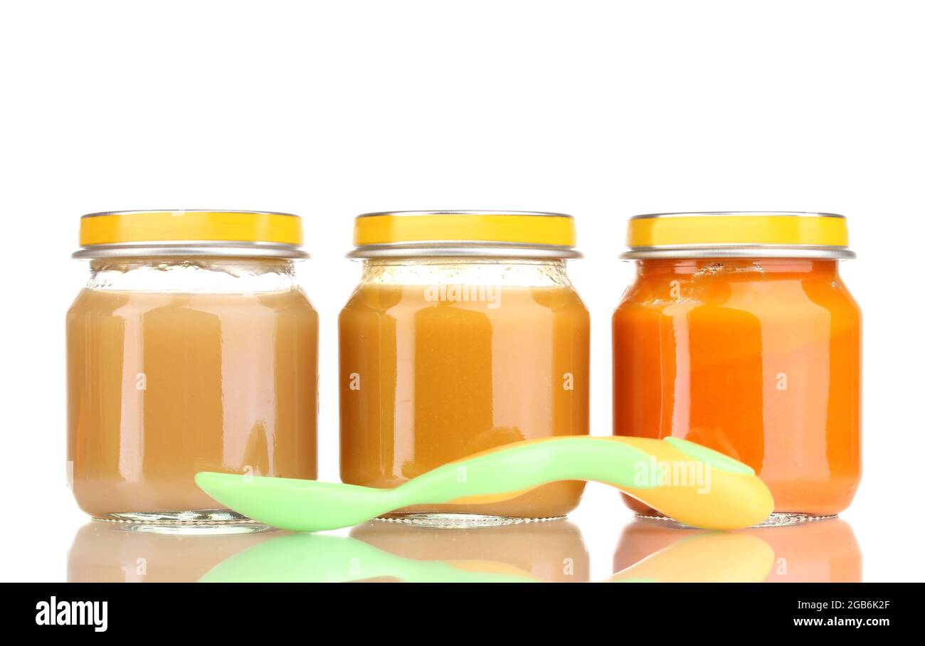 Jars of baby puree and spoon isolated on white Stock Photo - Alamy