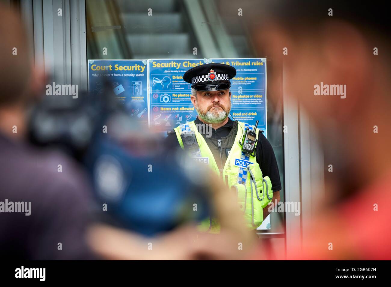 policeman standing guard at Manchester Magistrates’ Court Crown Square ...
