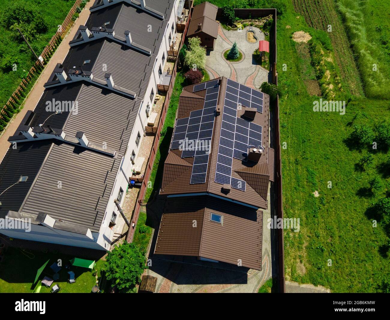 aerial view of house building with solar sun panels clean energy ...