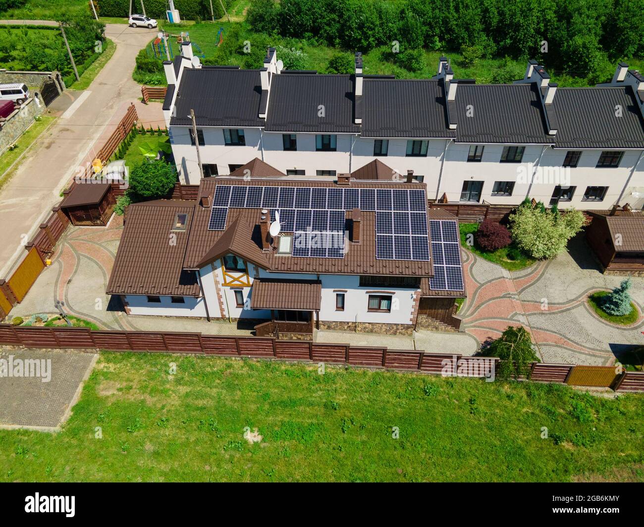 aerial view of house building with solar sun panels clean energy ...