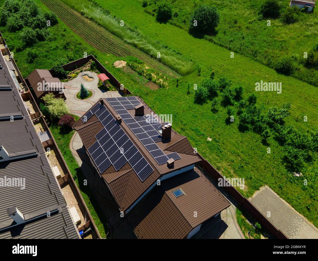 aerial view of house building with solar sun panels clean energy ...