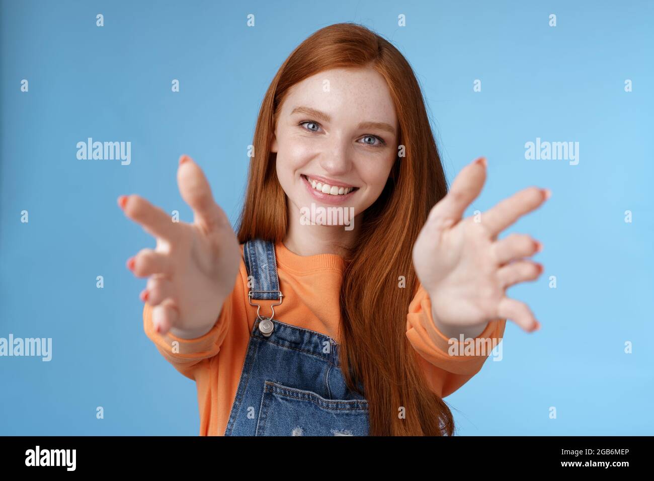 Come into arms. Charming sincere happy kind redhead girl baby sitting ...