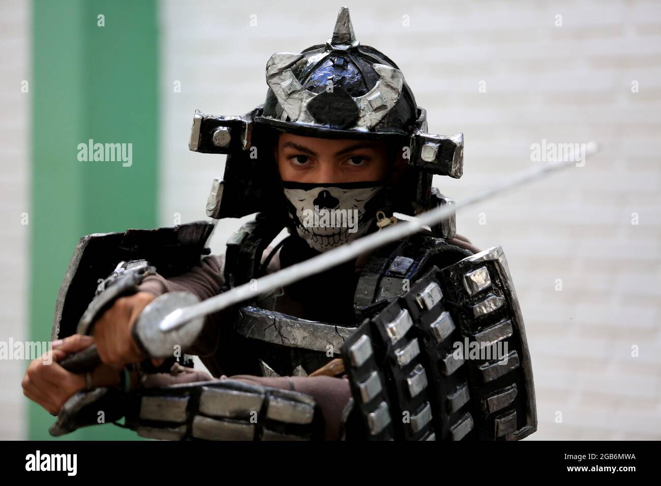 salvador, bahia, brazil - april 24, 2017: Young man wears armor made of ...