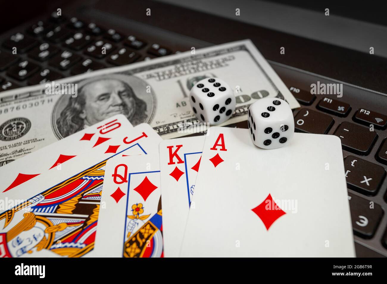 Chisinau, Moldova - 20. 12. 2020 dice, playing cards on laptop keyboard ...