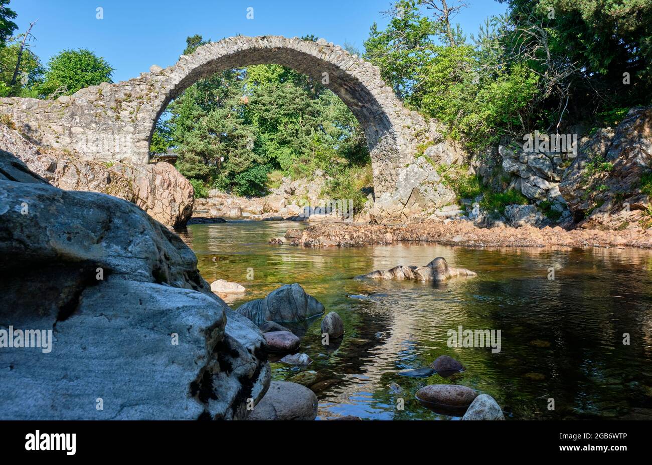 The old packhorse bridge across the River Dulnain at Carrbridge, near ...