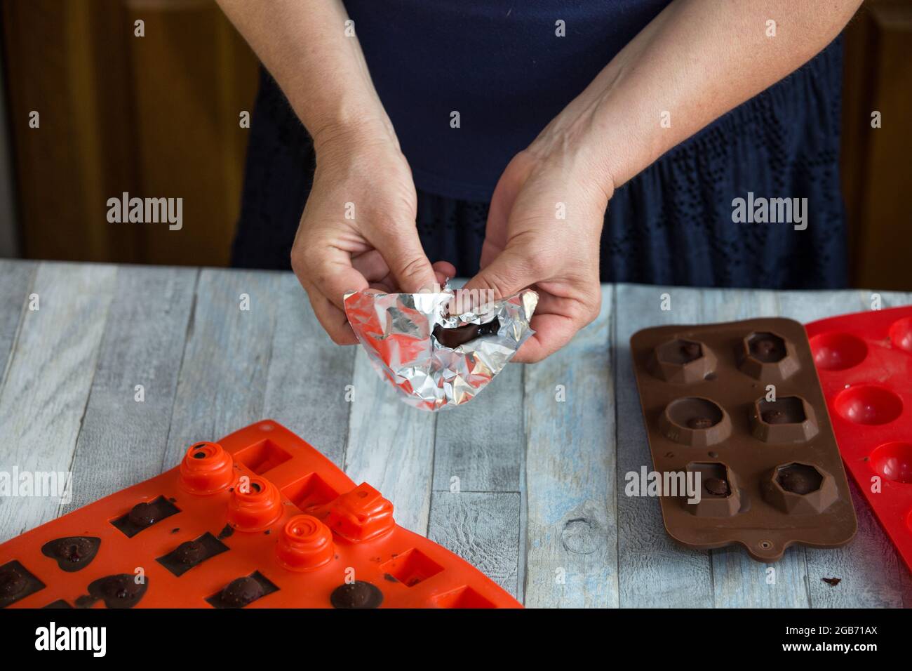 Step-by-step process of making chocolates from dark chocolate and ...