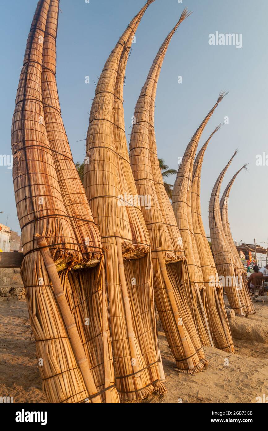 Traditional reed boats on a beach in Huanchaco, Peru Stock Photo - Alamy