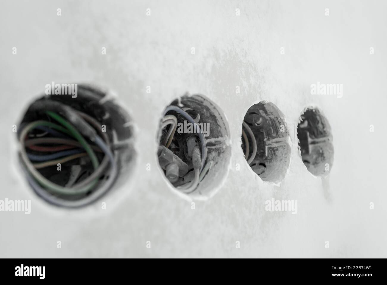 sockets with wires on a putty wall Stock Photo - Alamy