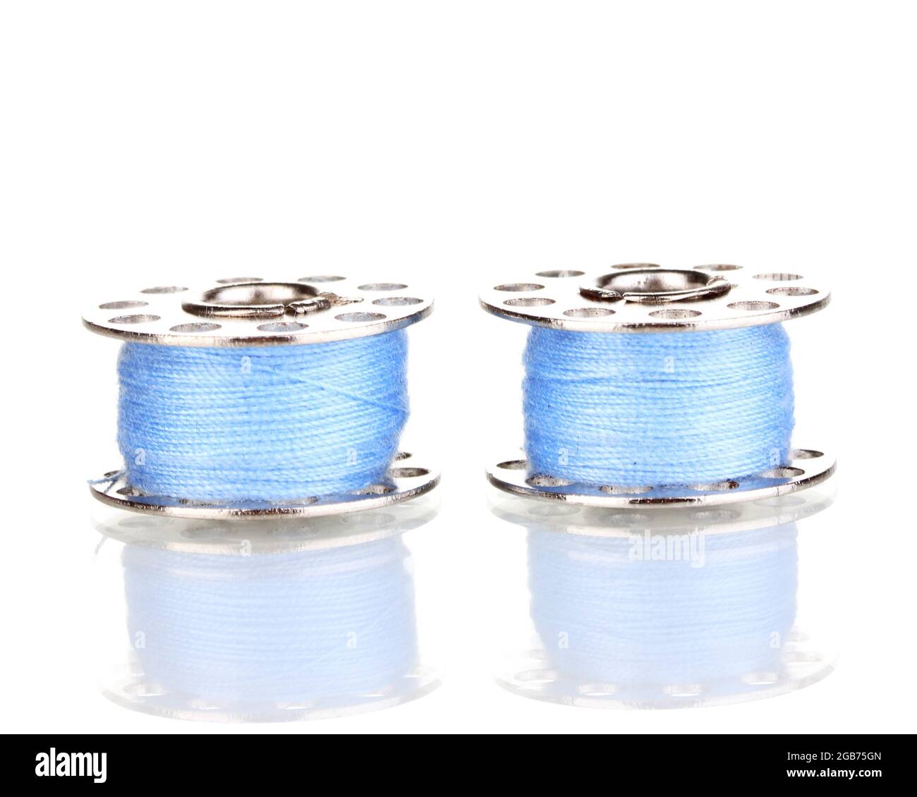 Metal spools of thread isolated on white Stock Photo - Alamy