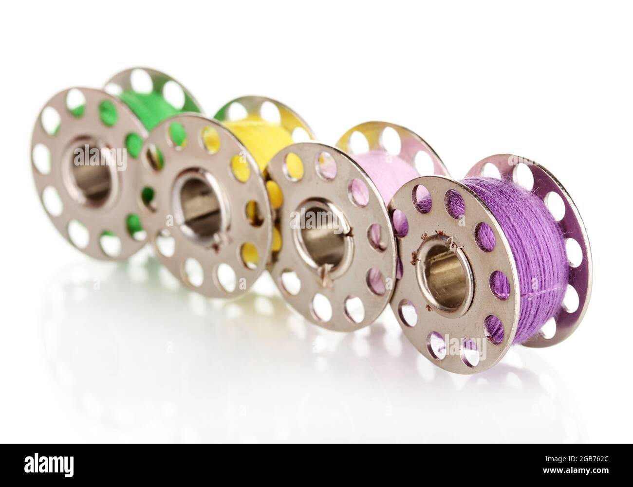 Metal spools of thread isolated on white Stock Photo - Alamy
