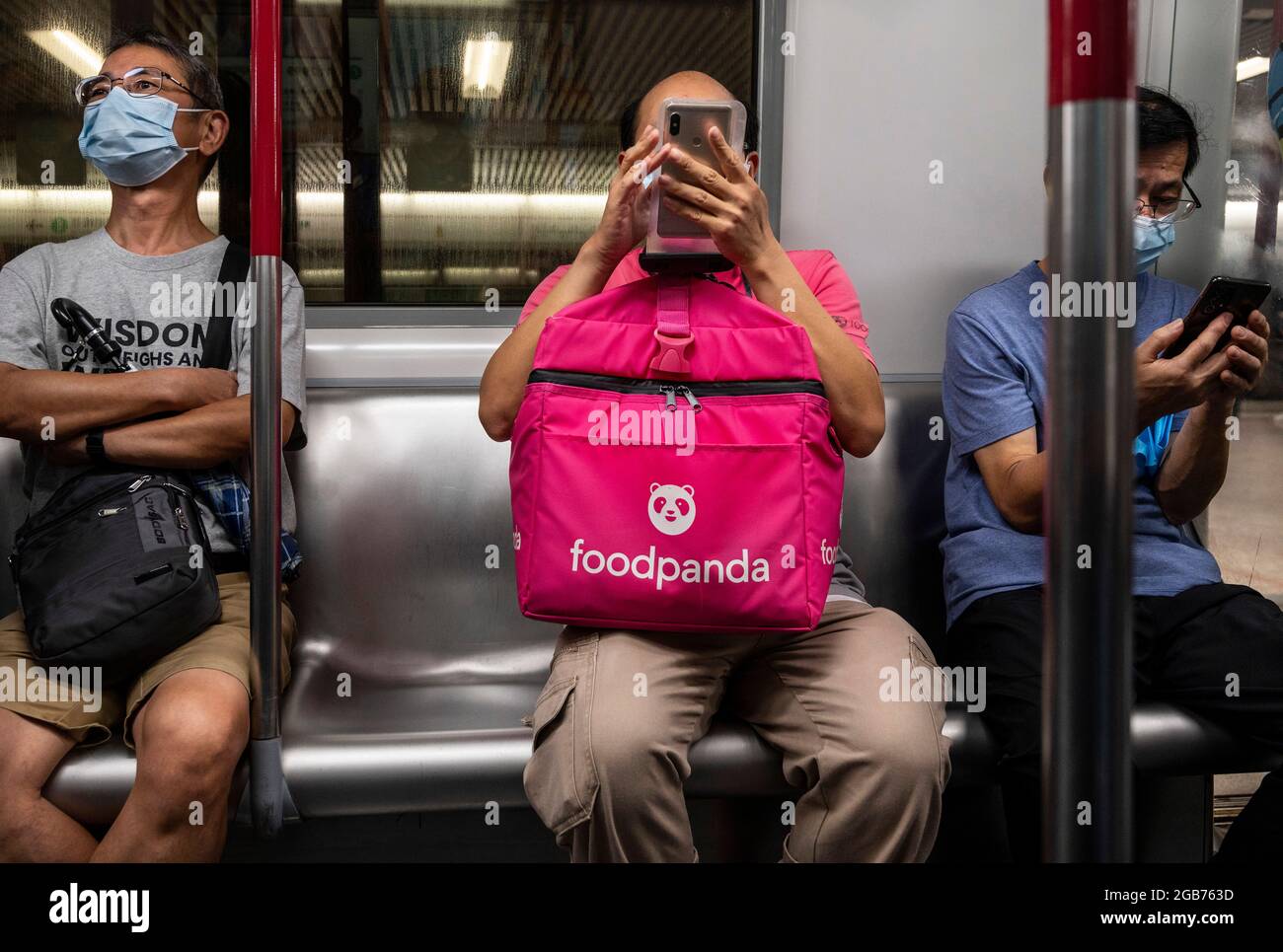 A delivery worker from a take out food delivery company, Food Panda is ...