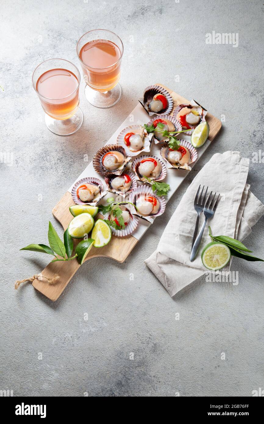 Raw Seafood shellfish scallops with lemon, cilantro and michelada beer ...