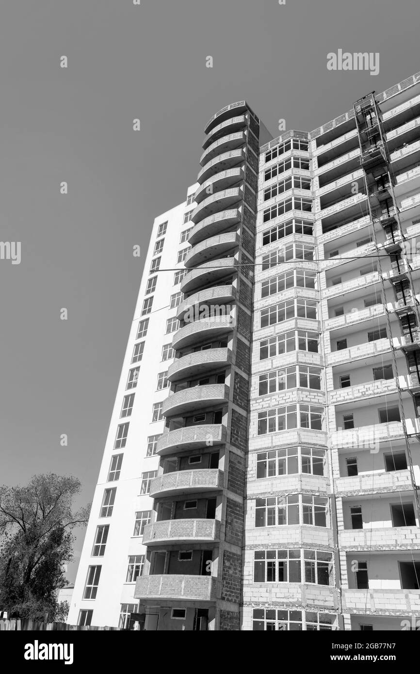 Black and white photo of a multi-storey residential building under ...