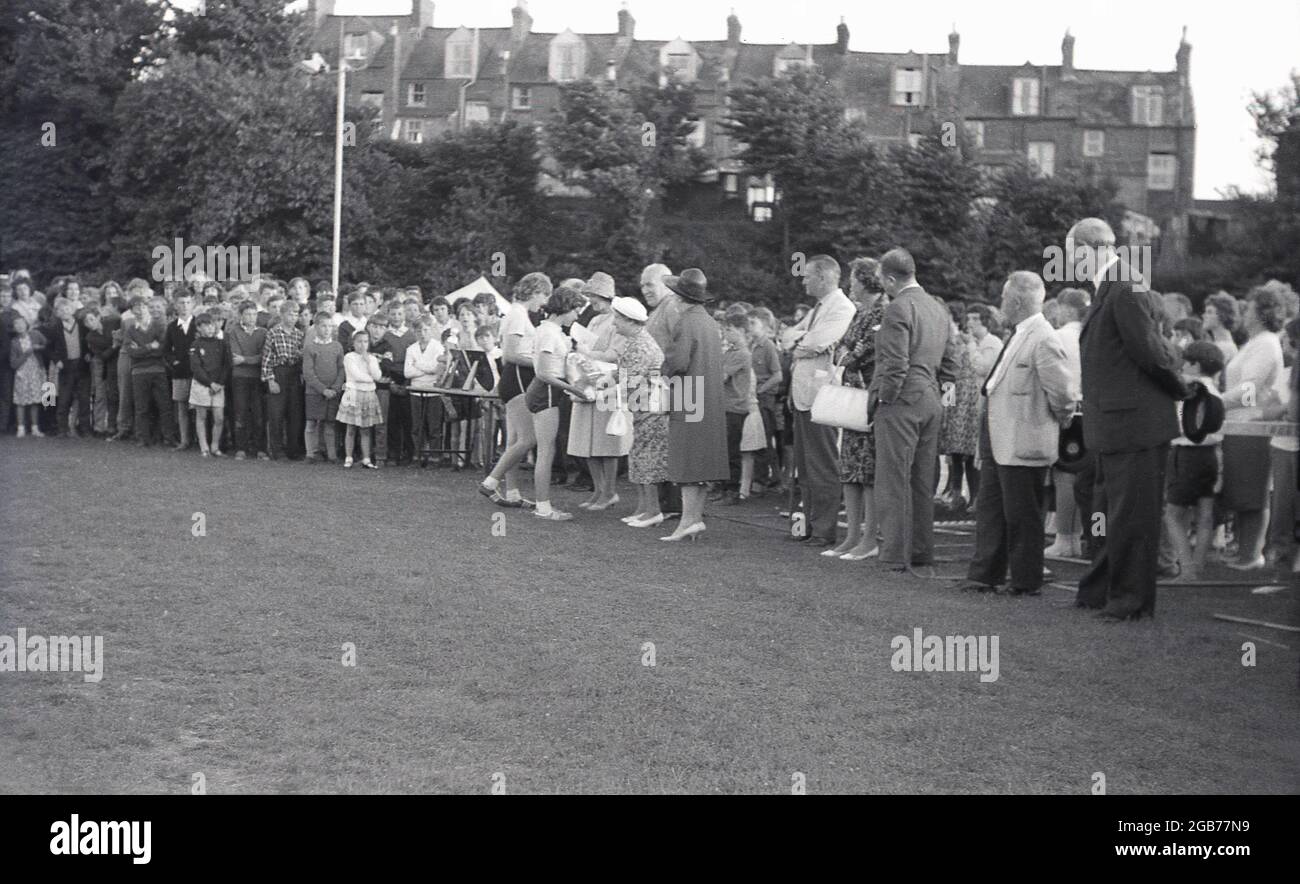 1964, historical, outside in field watched by parents and children, two ...
