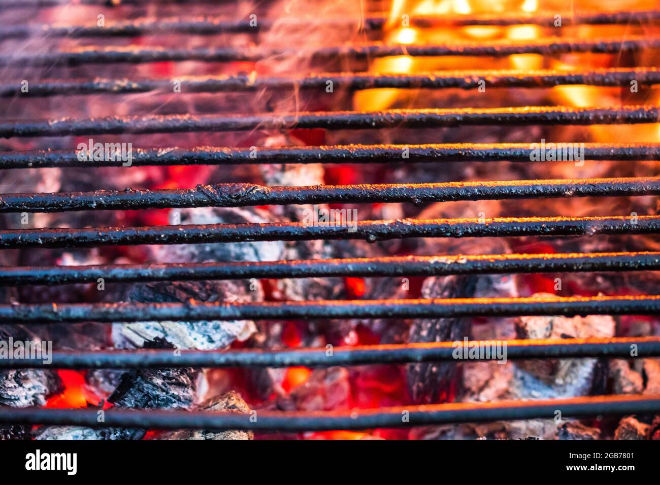 Empty hot charcoal barbecue grill with bright flame Stock Photo - Alamy