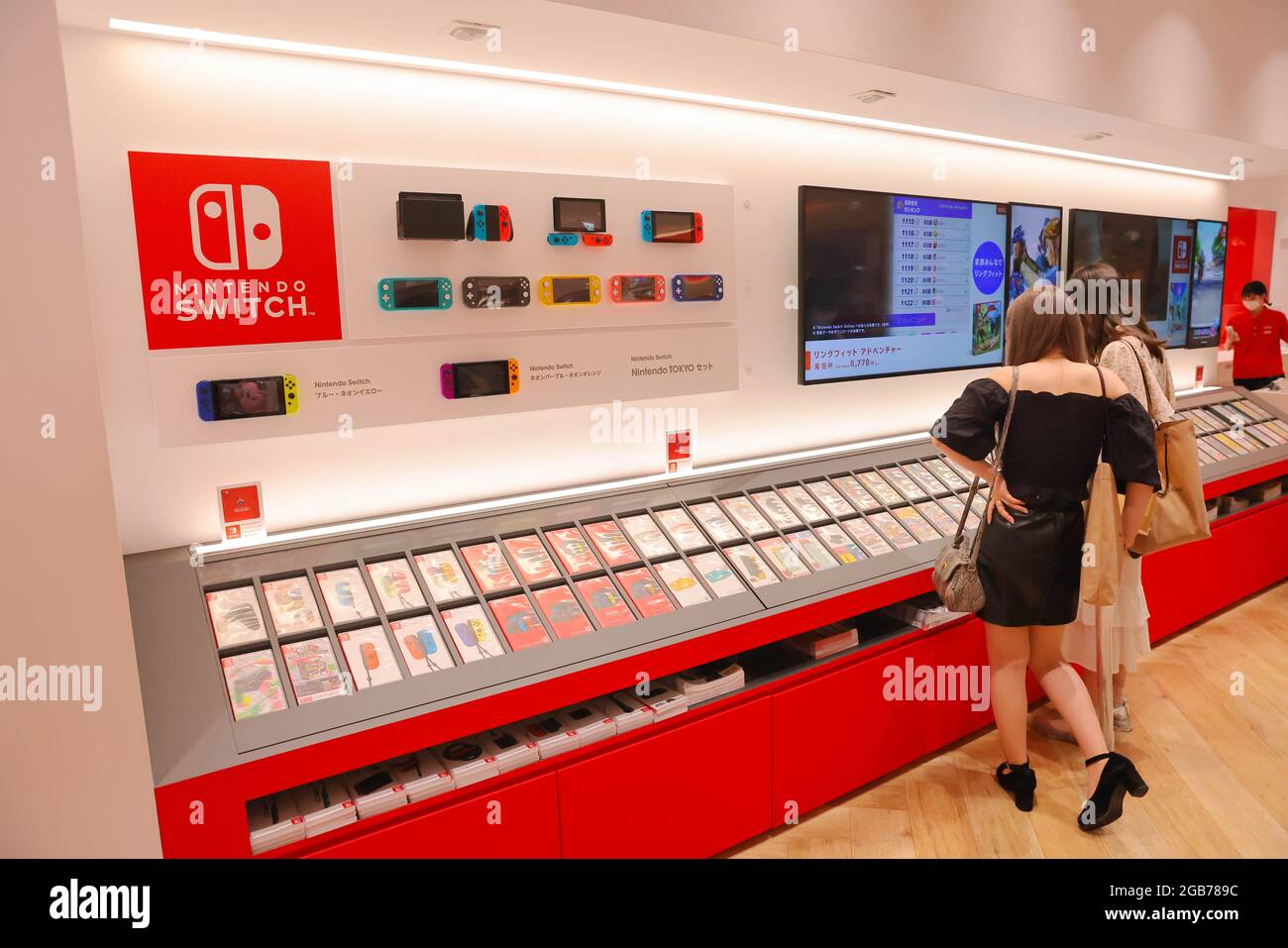 Visitors look at Super Mario themed products inside Nintendo Store in ...